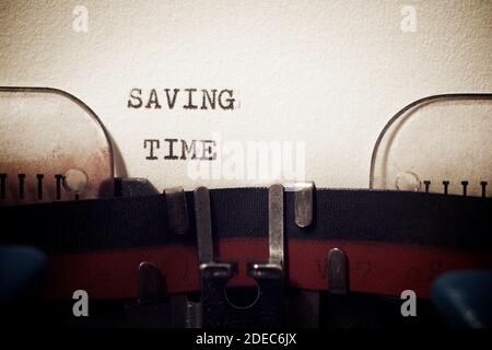 Saving time phrase written with a typewriter Stock Photo - Alamy