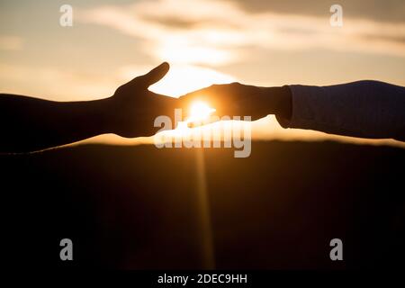 Handshake hand, arm on salvation. Close up help hand. Two hands, helping arm of a friend ...