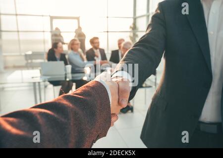 close up. strong handshake of business people Stock Photo - Alamy