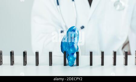 close up. doctor using dominoes to show a safe distance Stock Photo - Alamy