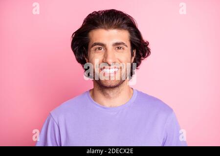 Photo of positive man toothy smile hold use telephone empty space ...