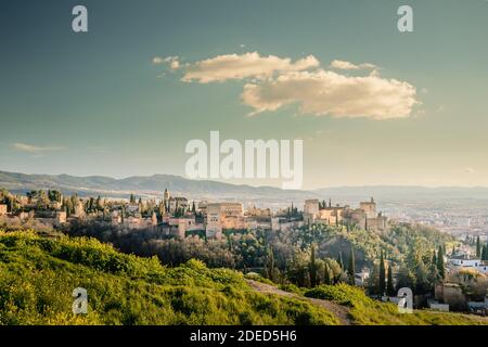 Panoramic view of the beautiful Granada City under the blue cloudy sky ...