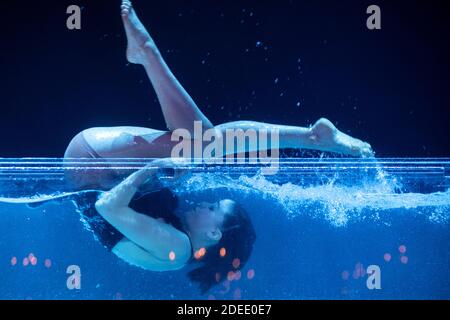 Dancer performs underwater dance routine Stock Photo - Alamy