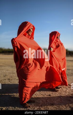 Wayuu indigenous women wearing traditional red costume, La Guajira ...
