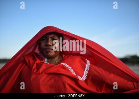 Wayuu indigenous woman wearing traditional red costume, La Guajira ...