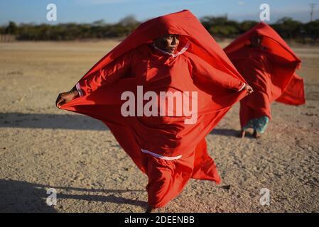 Wayuu indigenous women wearing traditional red costume, La Guajira ...