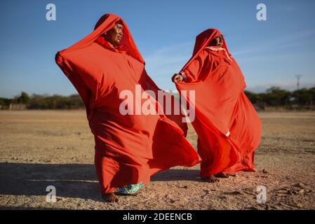 Wayuu indigenous women wearing traditional red costume, La Guajira ...