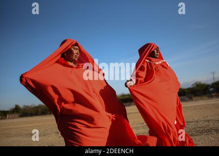 Wayuu indigenous women wearing traditional red costume, La Guajira ...