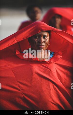Wayuu indigenous women wearing traditional red costume, La Guajira ...