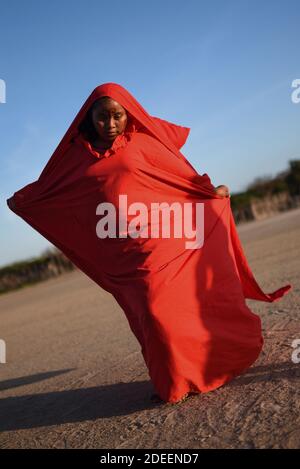 Wayuu indigenous woman wearing traditional red costume, La Guajira ...