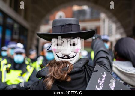 Police officers stands in a line in front of Rangers fans during the ...