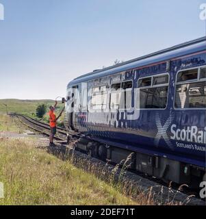 Glenwhilly Network Rail signaller exchanging single line tokens with ...