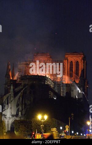 Smoke and flames rise during a fire at the landmark Notre-Dame ...