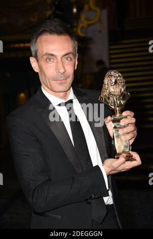 Benoit Soles posing with his award for 'La machine de Turing' during ...