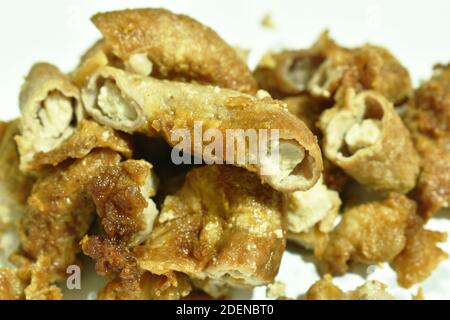 batter fried pork innards with flour on white background Stock Photo ...