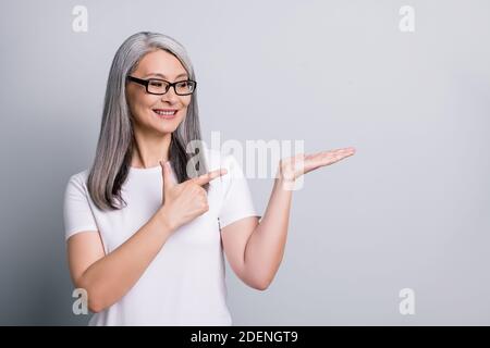 Photo of curious lady indicate finger empty space promote sale wear ...