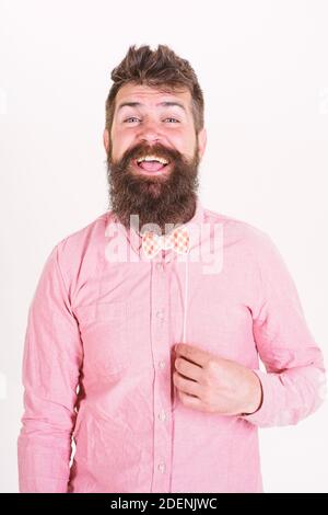 smiling man with red bowtie party props Stock Photo - Alamy