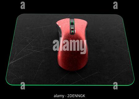Used metal red gaming mouse with scratches on professional pad isolated ...