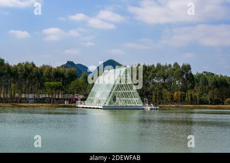 Glass house triangle church by the lake Stock Photo - Alamy