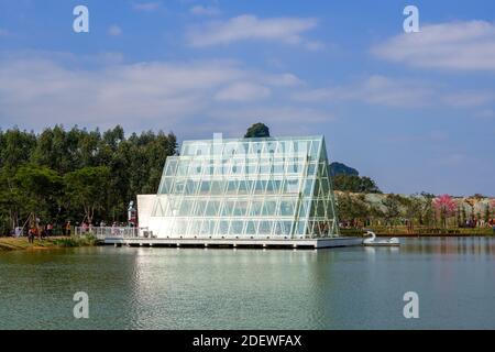 Glass house triangle church by the lake Stock Photo - Alamy