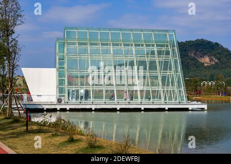 Glass house triangle church by the lake Stock Photo - Alamy