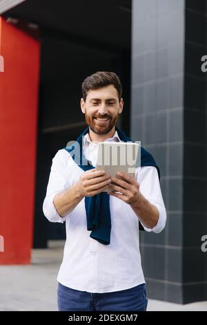 Smiling young man talking using sign language. Happy guy communicate ...