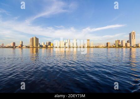Commercial buildings in Manila as seen from Manila Bay, Philippines ...
