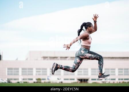 Stock photo of an African-American sprinter lying down on an athletics ...
