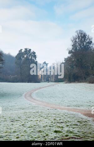 Winding track leading to gatehouse at Ashton Court on a frosty winter ...