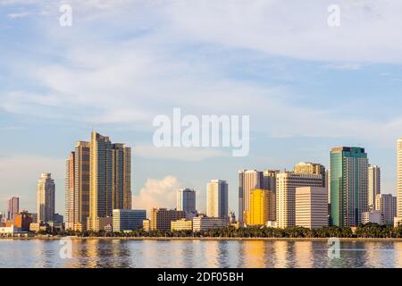 Commercial buildings in Manila as seen from Manila Bay, Philippines ...
