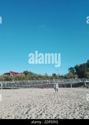 SARBINOWO, POLAND - Aug 06, 2018: People on sand at a beach in the ...