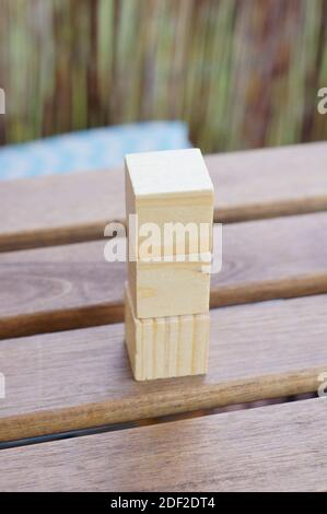 Top view to wooden blocks shape sorter toy parts on yellow and blue ...