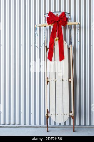 Classic christmas background with a red sled and a christmas tree over ...