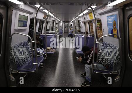 Passenger keep a social distance as they ride a train in Washington ...
