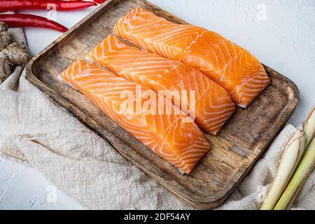 Raw salmon meat for cutlets, on white textured background, top view ...