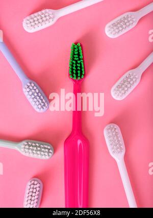 Different tooth brushes on color background Stock Photo - Alamy