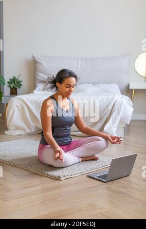 african american woman doing yoga pose at home Stock Photo - Alamy