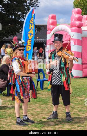 Man and woman musicians playing violin at music studio Stock Photo - Alamy