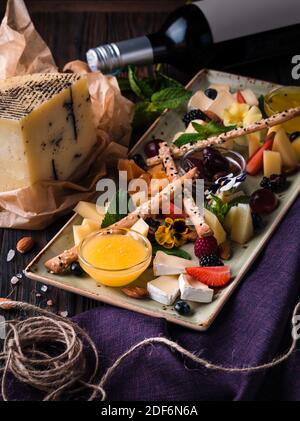 Cheese plate served with grapes, various cheese on a platter Stock ...