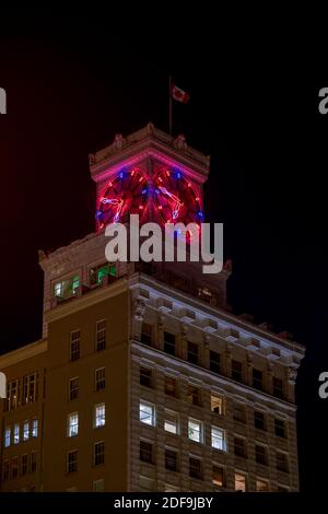 The Vancouver Block building neon clock tower on Granville Street in ...
