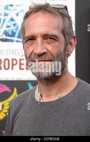 Street artist Gregos is seen as a street art performance takes place to ...