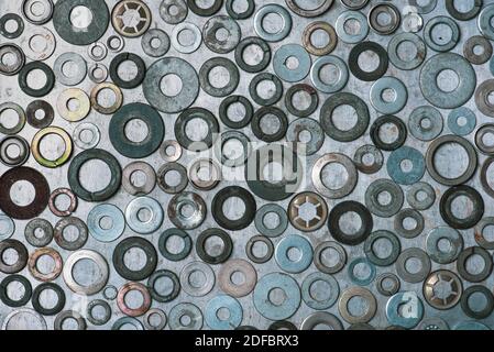 Washers on metallic background top view Stock Photo - Alamy