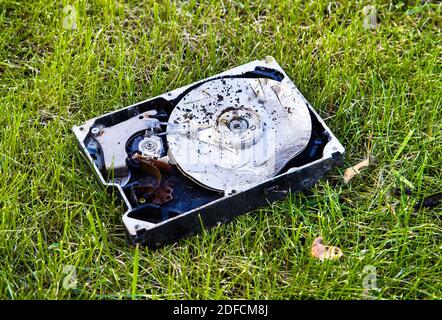 Crushed Hard Disk Drive on the Old Book outdoor Stock Photo - Alamy