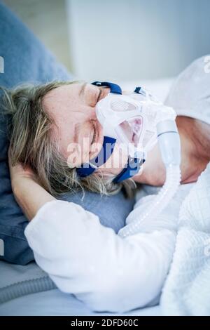 Patient suffering Obstructive Sleep Apnea Syndrome (OSAS) connected ...