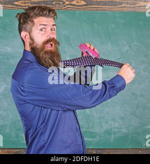 Man scruffy use stapler dangerous way. Hipster teacher formal wear ...
