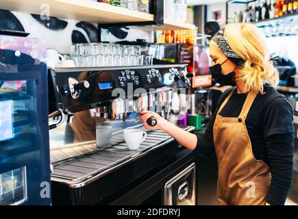 Girl in blue mask is making selfie by smartphone on battlefield of ...