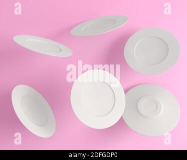 Flying clean plates on white background Stock Photo - Alamy