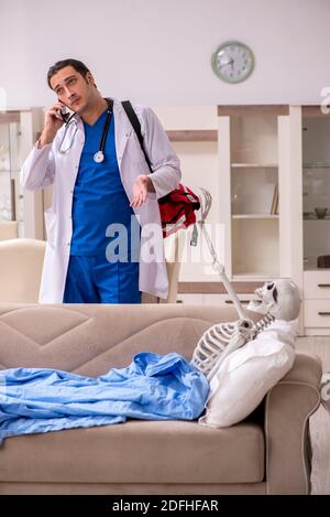 Male paramedic visiting skeleton patient Stock Photo - Alamy