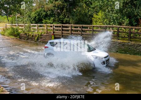 Car splashing through Rufford Ford, Rufford Lane, Rufford Country Park ...