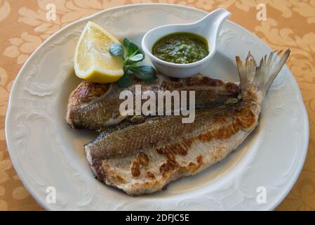 Lavarello in salsa verde,lake como traditional,fish Stock Photo - Alamy